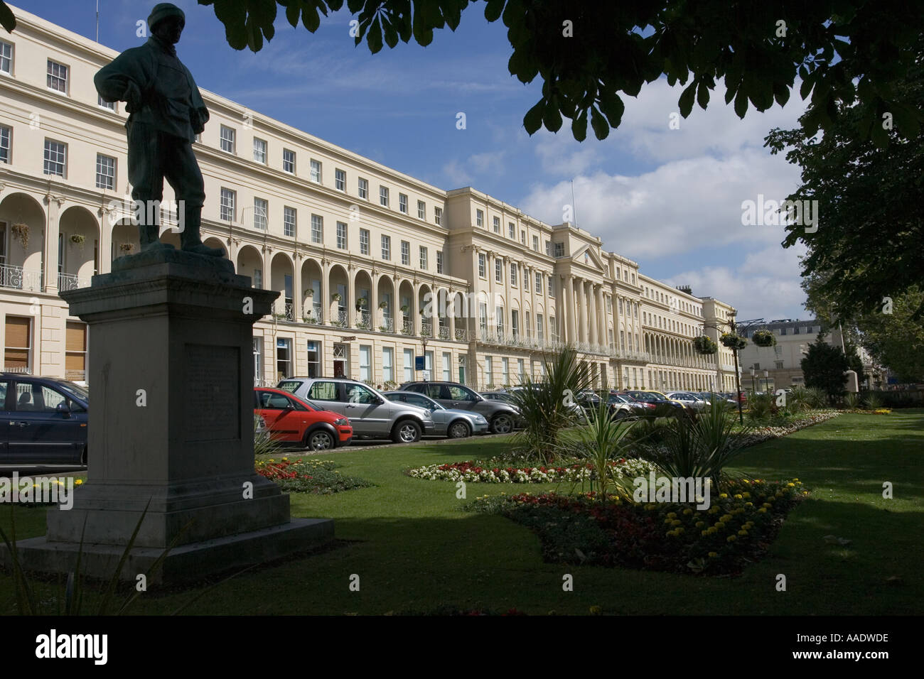 Statue of explorer Edward Wilson silhouetted in front of Cheltenham ...