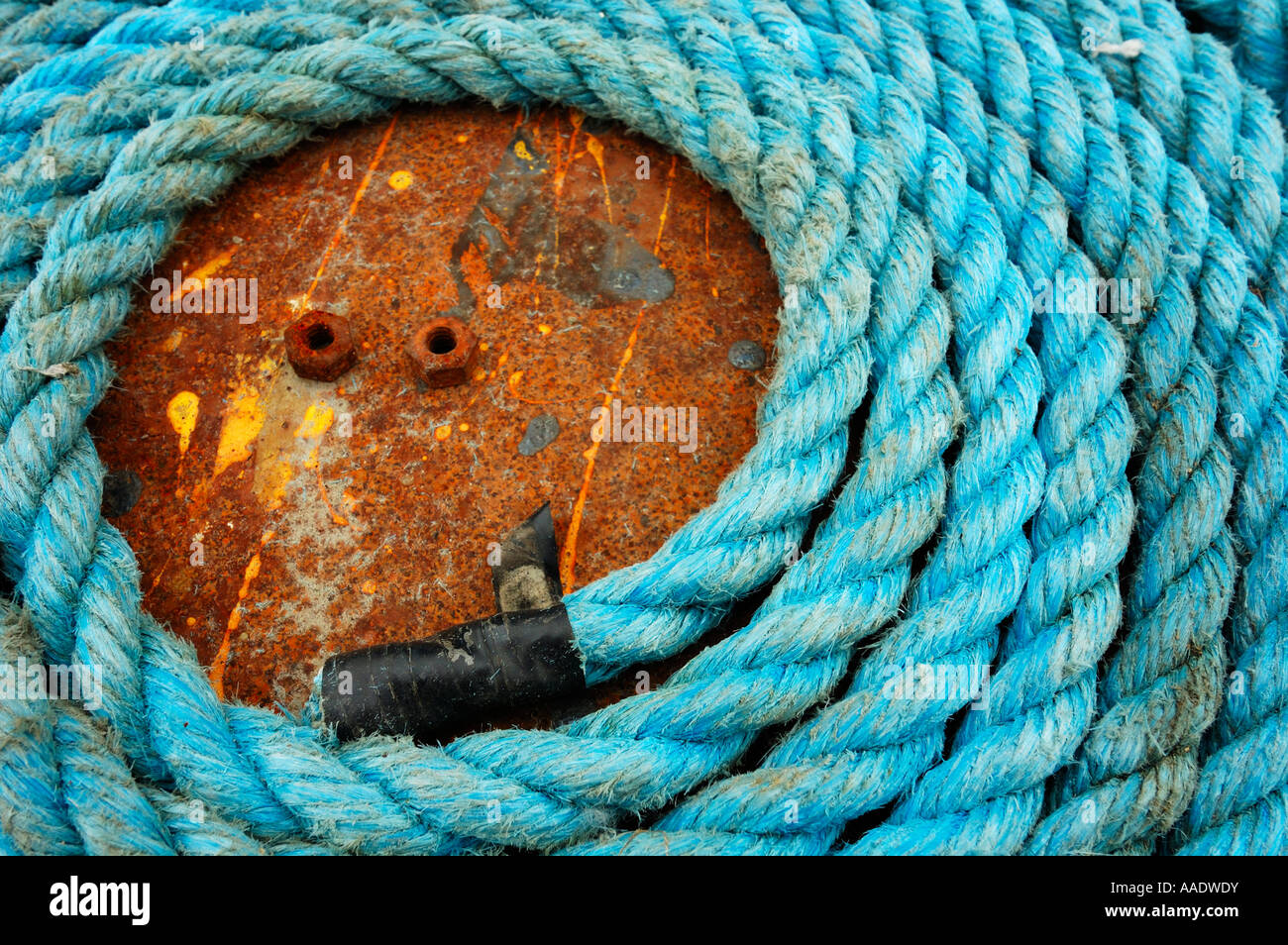 Rope coil on a rusty deck Stock Photo - Alamy