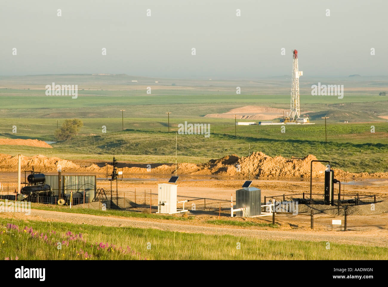 drilling rig and storage tanks on pads in the Texas Panhandle Stock ...