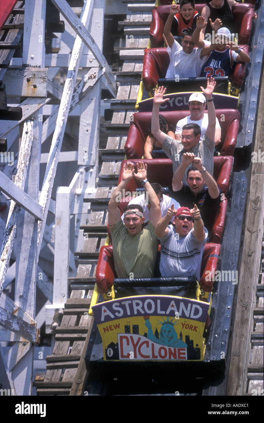 Riders on a roller coaster Stock Photo - Alamy