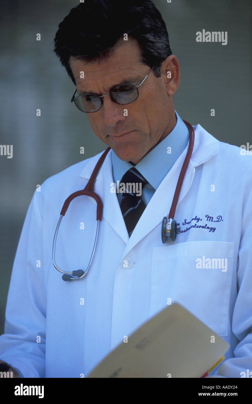 Medical doctor in lab coat wearing stethoscope Stock Photo - Alamy