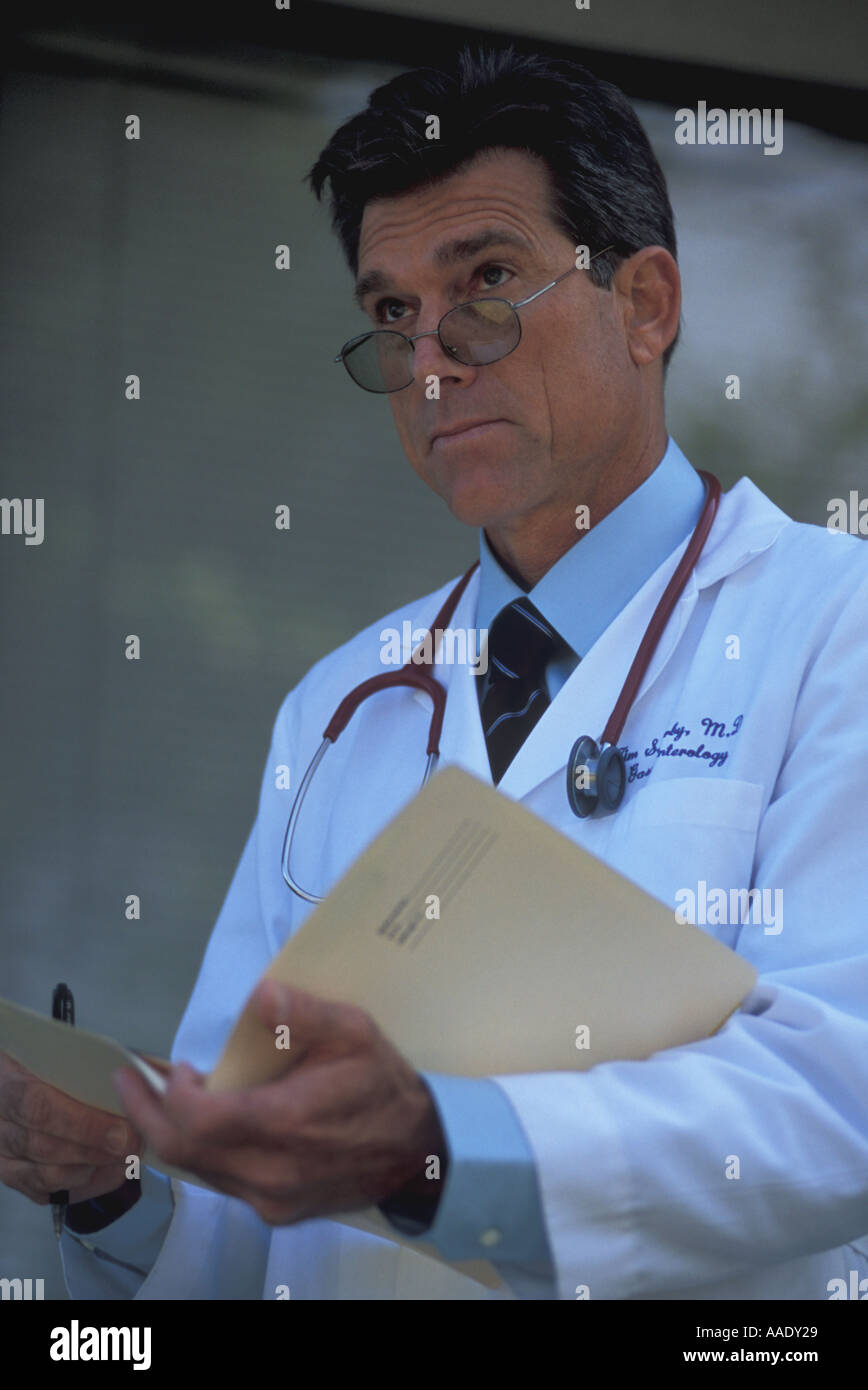 Medical doctor in lab coat wearing stethoscope Stock Photo - Alamy