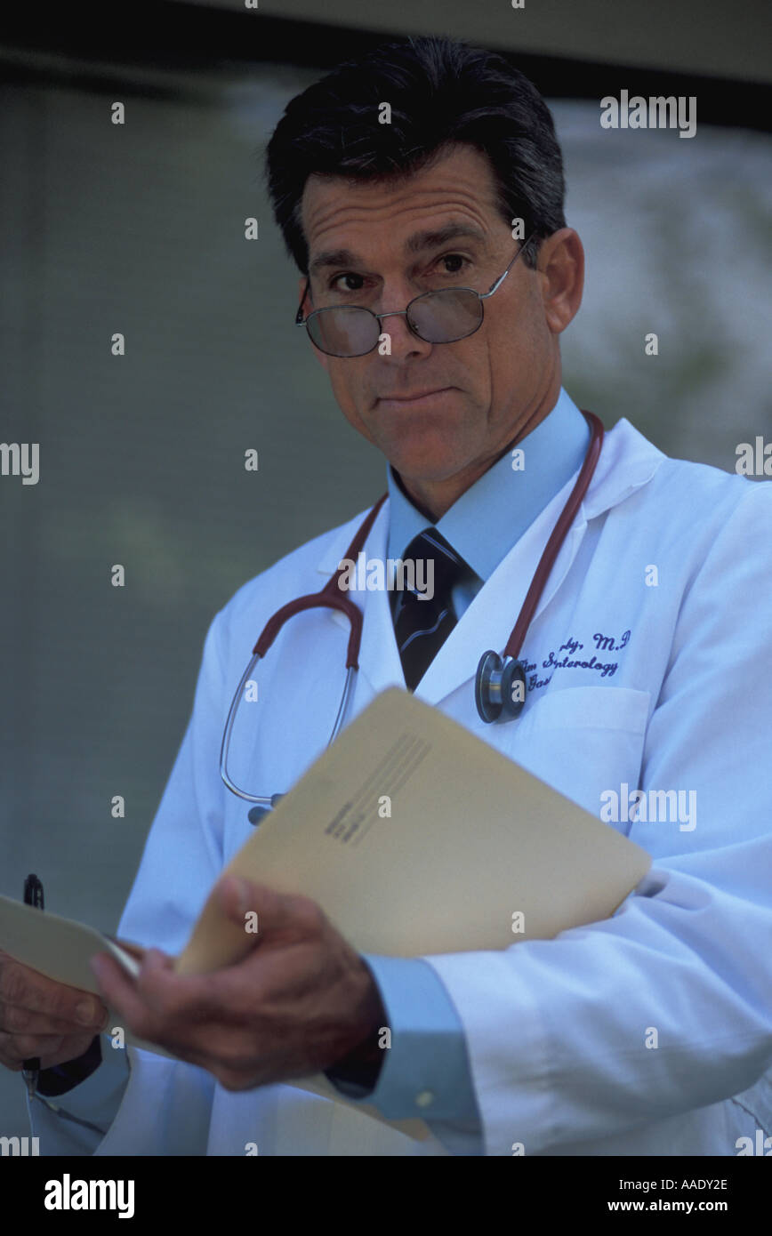 Medical doctor in lab coat wearing stethoscope Stock Photo - Alamy