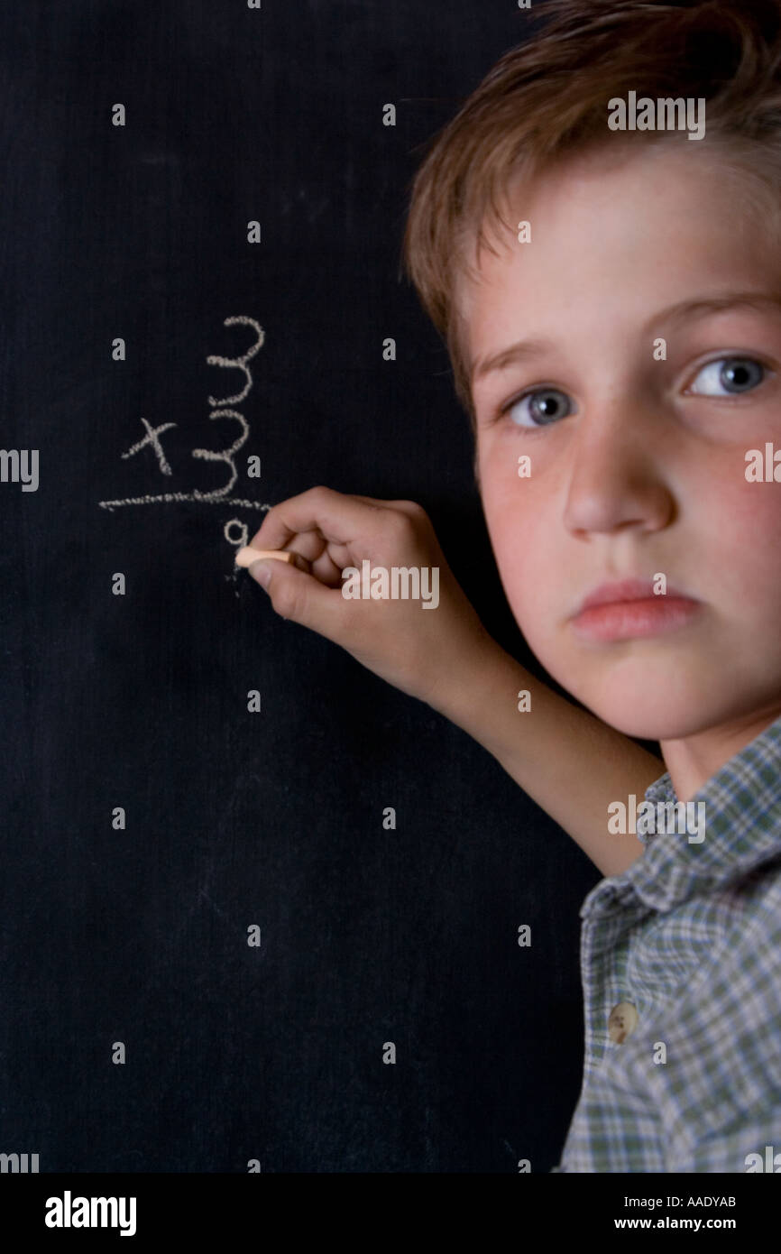 Boy at chalkboard Stock Photo - Alamy