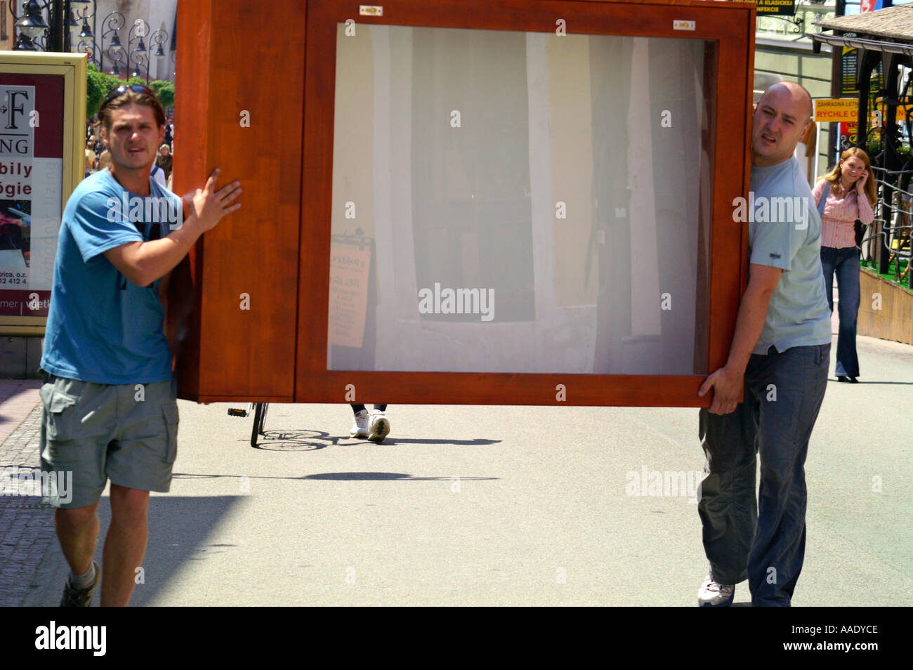 Men Carrying a Window Stock Photo - Alamy