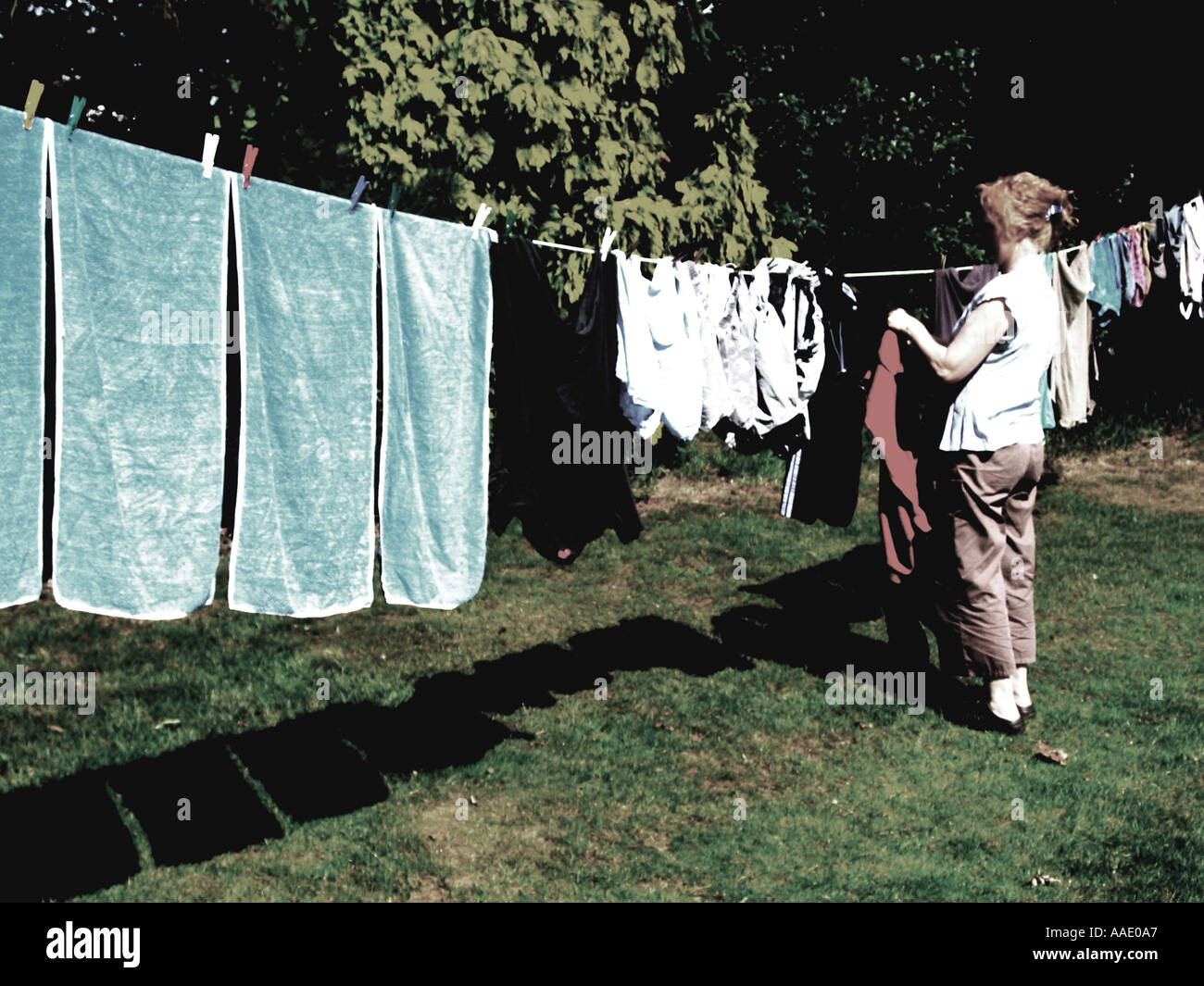 Woman washing line sheets hi-res stock photography and images - Alamy