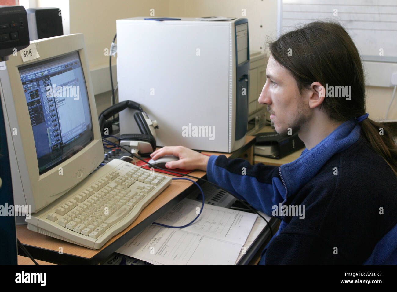 Male Student using computer in sixth form college Stock Photo - Alamy