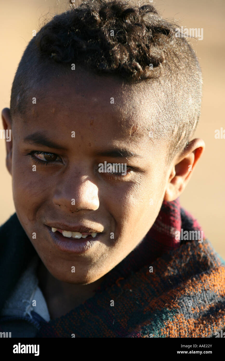 Shepherd boy at camp at dawn while trekking in the Simien Mountains ...