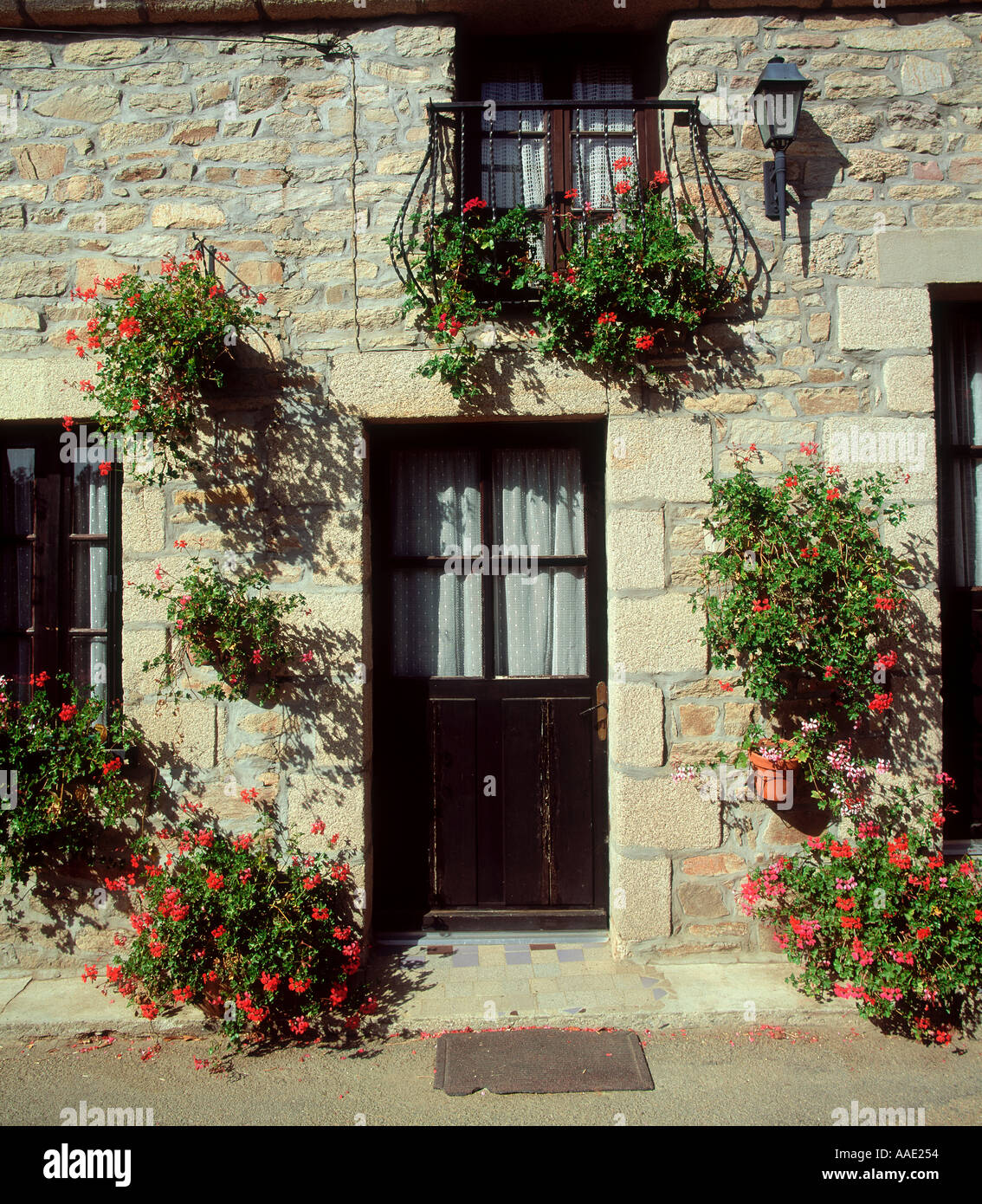 RURAL FRENCH COTTAGE WITH HANGING BASKETS Stock Photo - Alamy