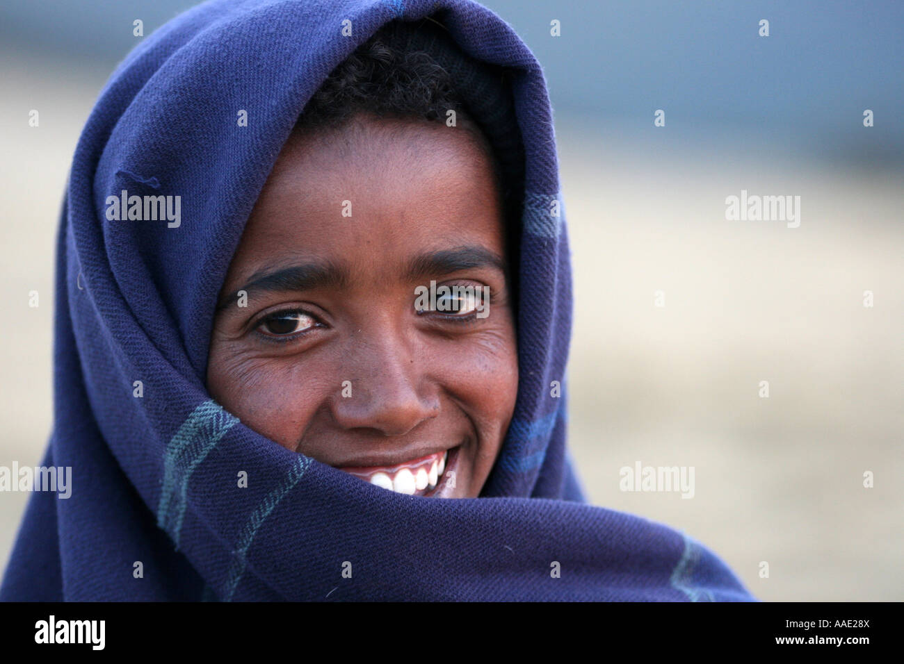 Shepherd boy at camp at dawn while trekking in the Simien Mountains ...