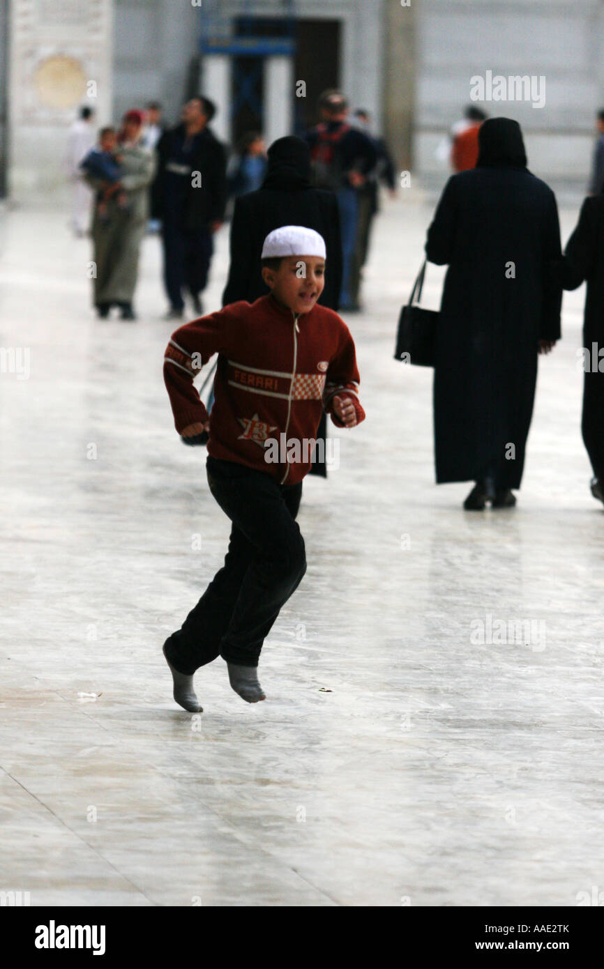 Boy running through The Umayyad Great Mosque, Old Town Damascus, Syria ...