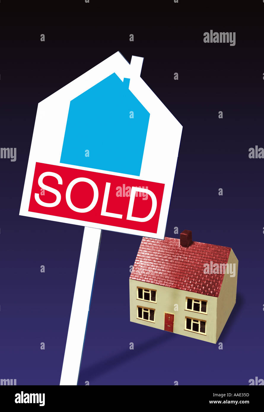 house with house sold sign Stock Photo - Alamy