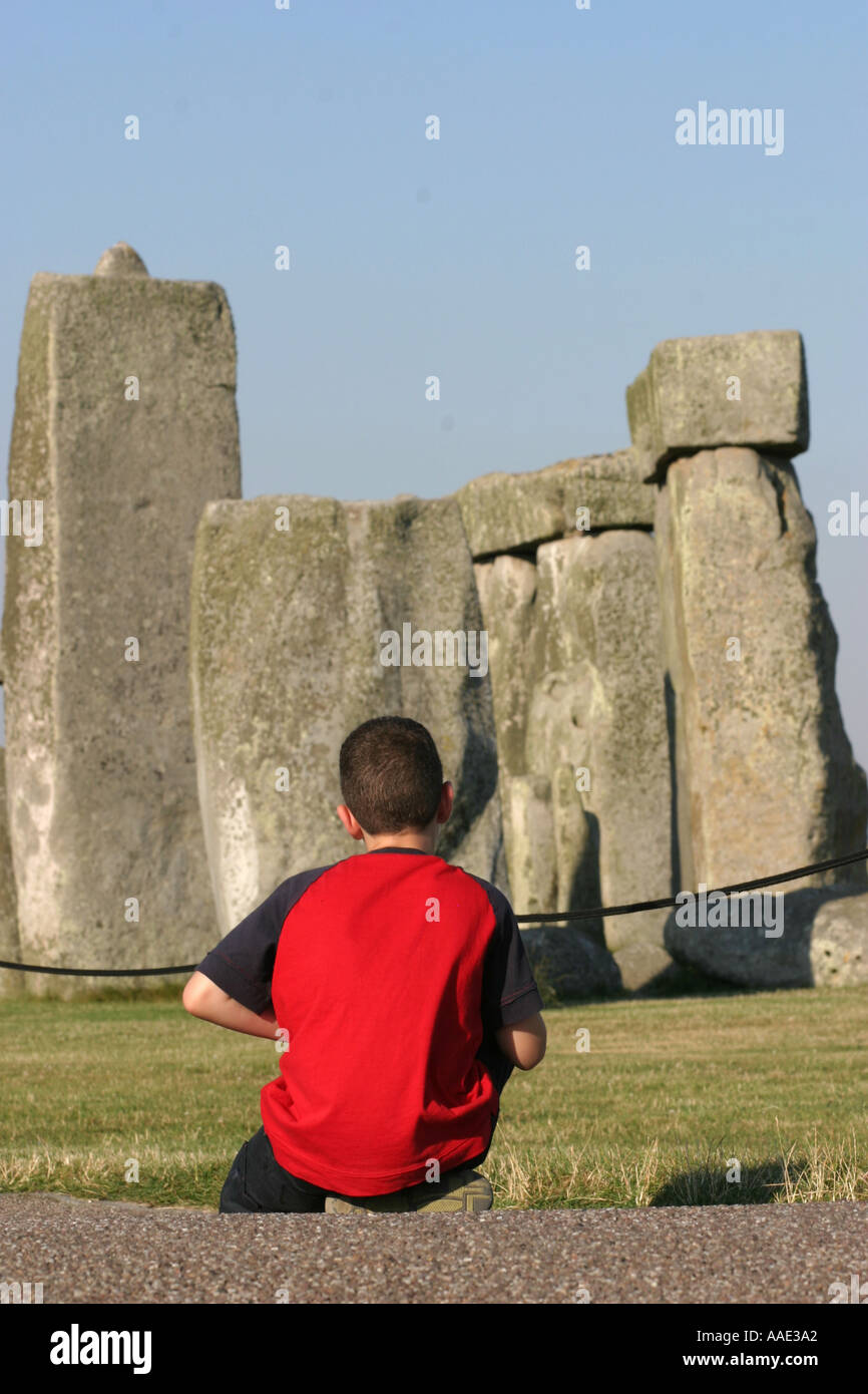 Young boy gazing at Stonehenge Stock Photo - Alamy