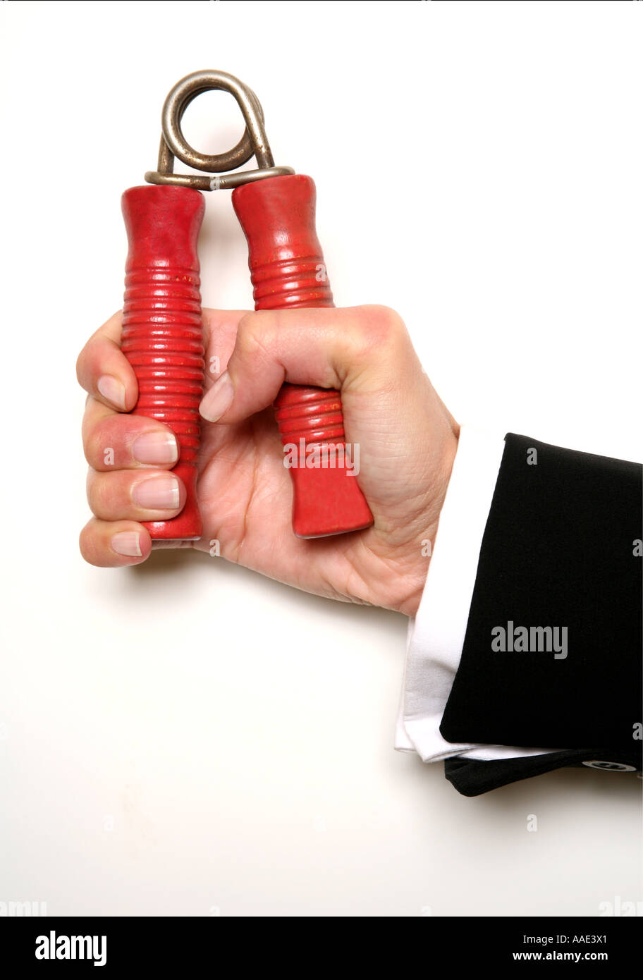 Hand squeezing a handgrip Stock Photo - Alamy