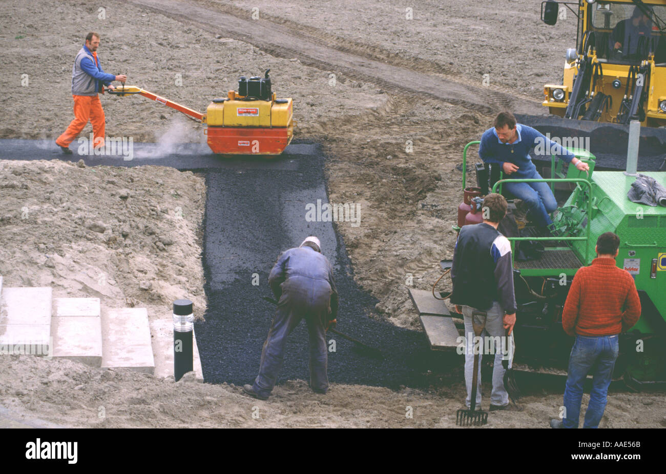 Men constructing a road in a new park Stock Photo - Alamy