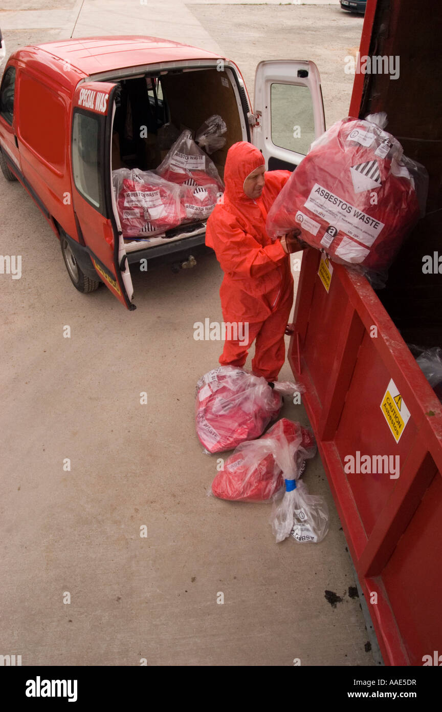 Transferring Bagged Asbestos Waste from vehicle into a Skip Stock Photo ...