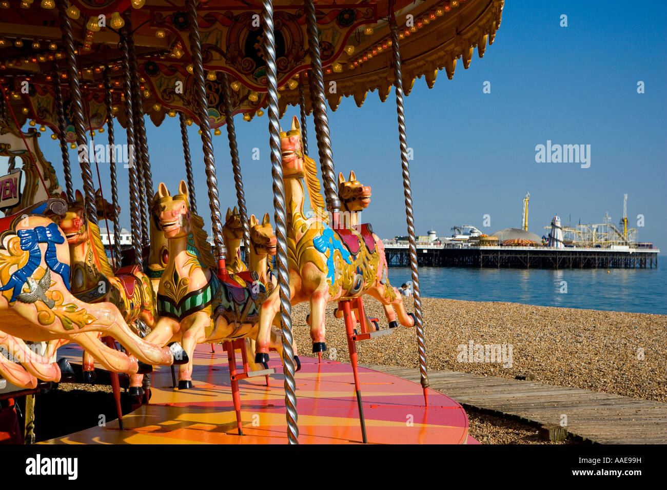 Carousel at Brighton with the Palace Pier in shot Stock Photo - Alamy