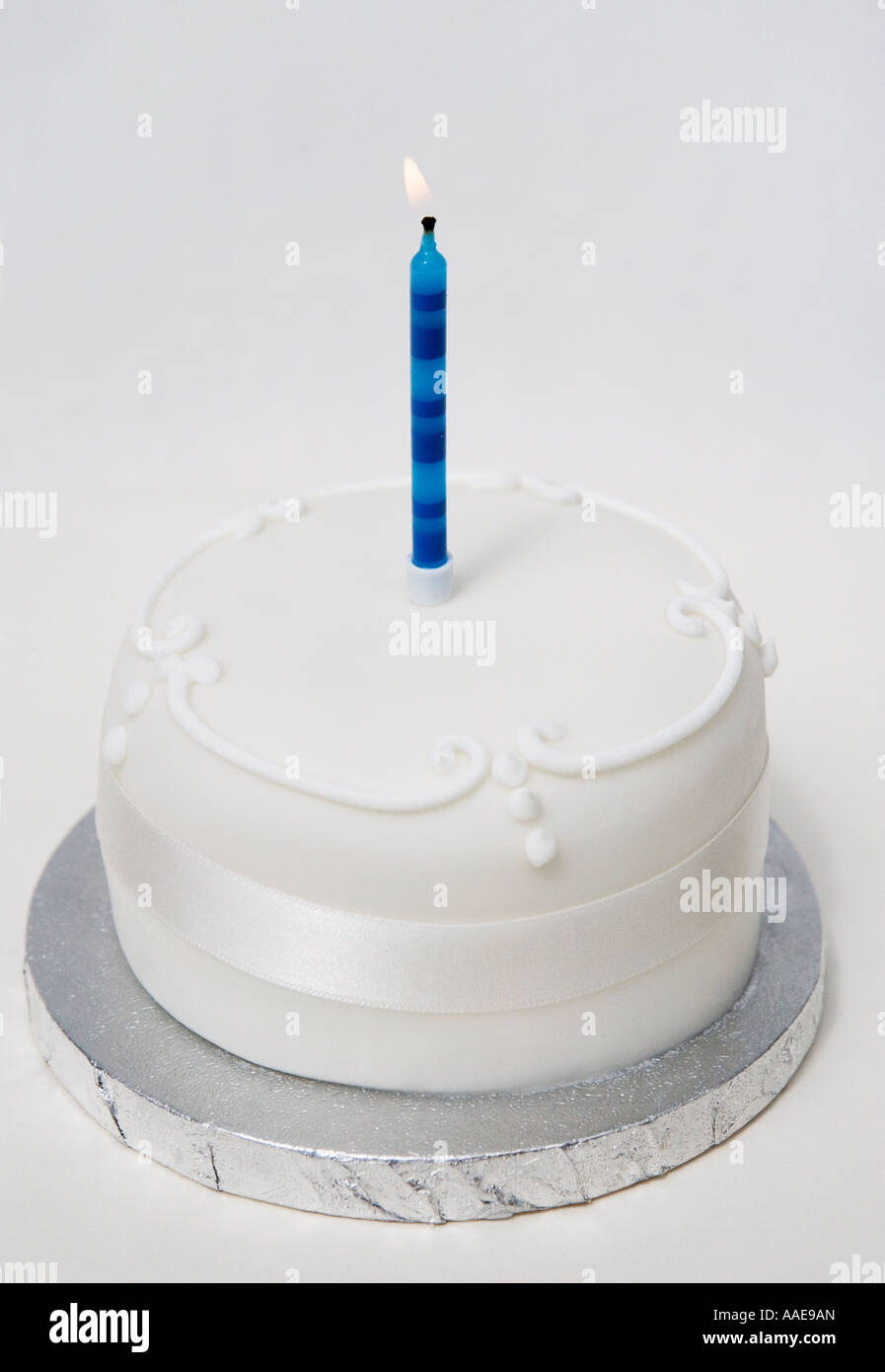 Birthday cake with one coloured candle Stock Photo - Alamy