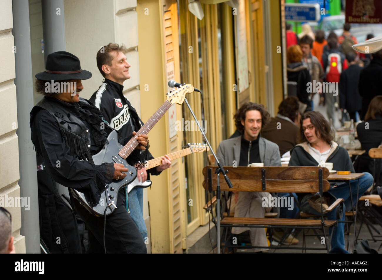 Street musicians play outside a cafe in Paris France Stock Photo - Alamy