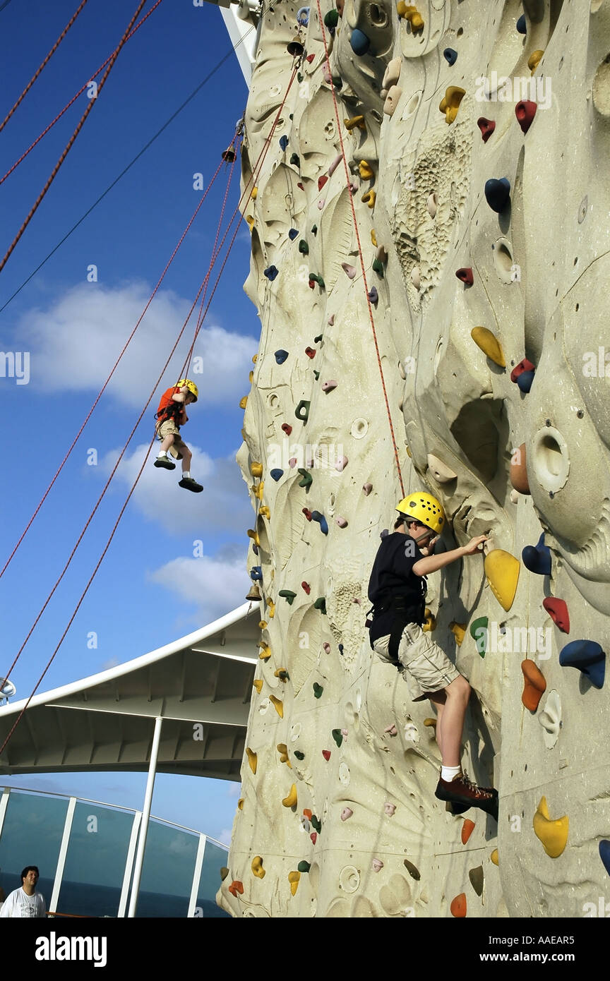 climbers on an artificial climbing wall onboard the explorer of the ...