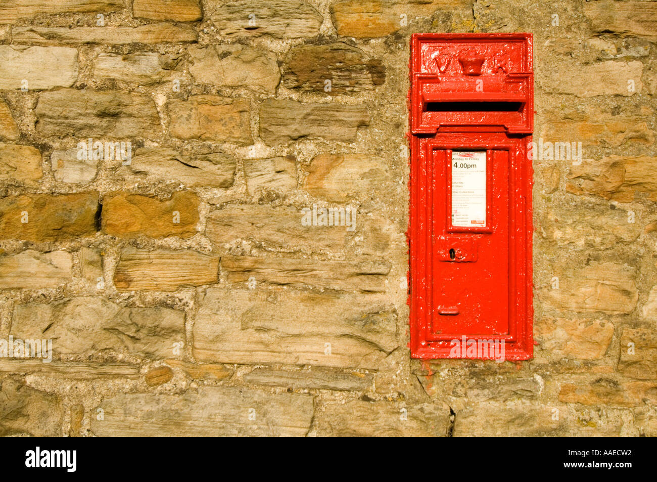 Victorian post box build into the wall of the house in Thwaite village ...