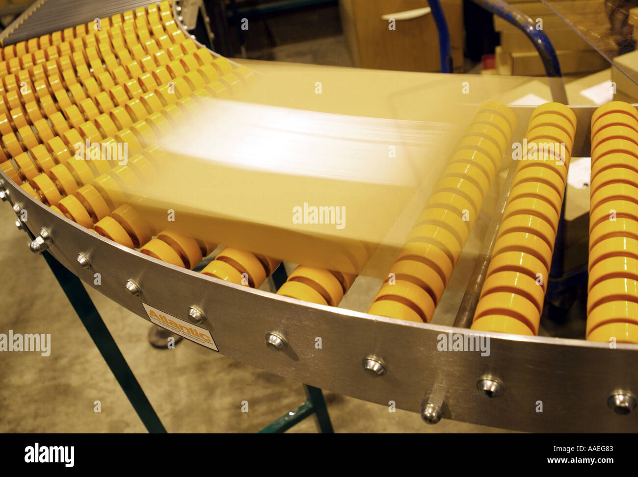 package on conveyor rollers in warehouse Stock Photo - Alamy