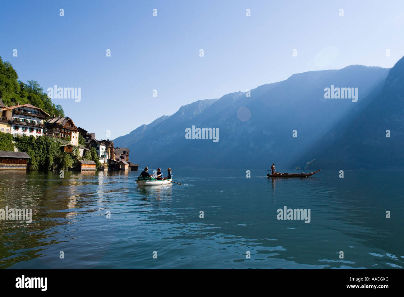 View over lake Hallstatt with boats to houses at lakeshore Hallstatt ...
