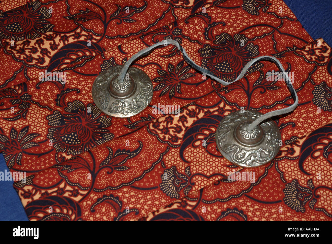 Finger cymbals on treatment table of cruise ship spa Stock Photo - Alamy