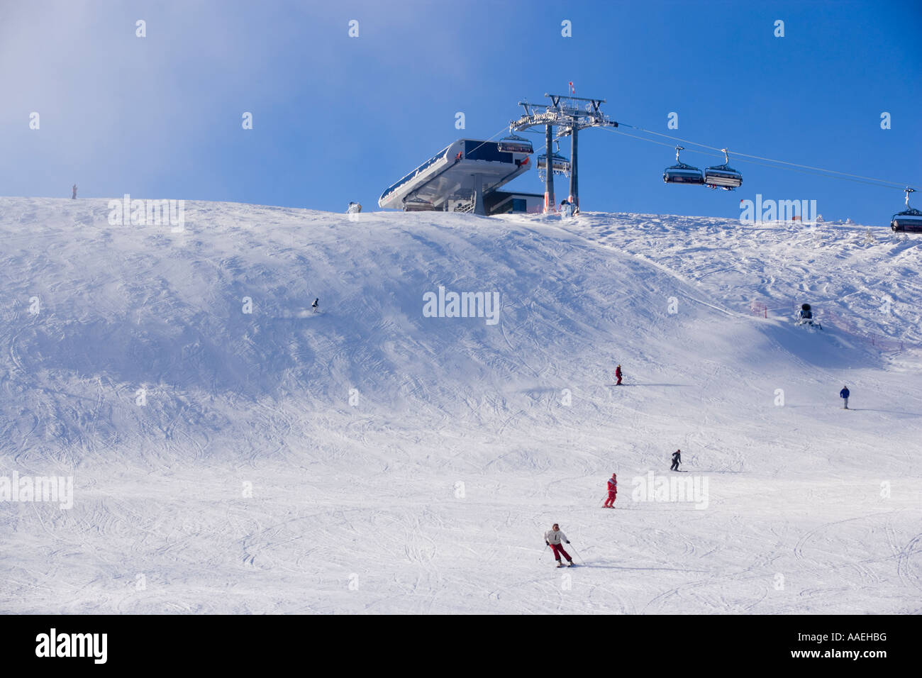 Mountain station and chair lift skiers on slope Flachau Salzburger Land ...