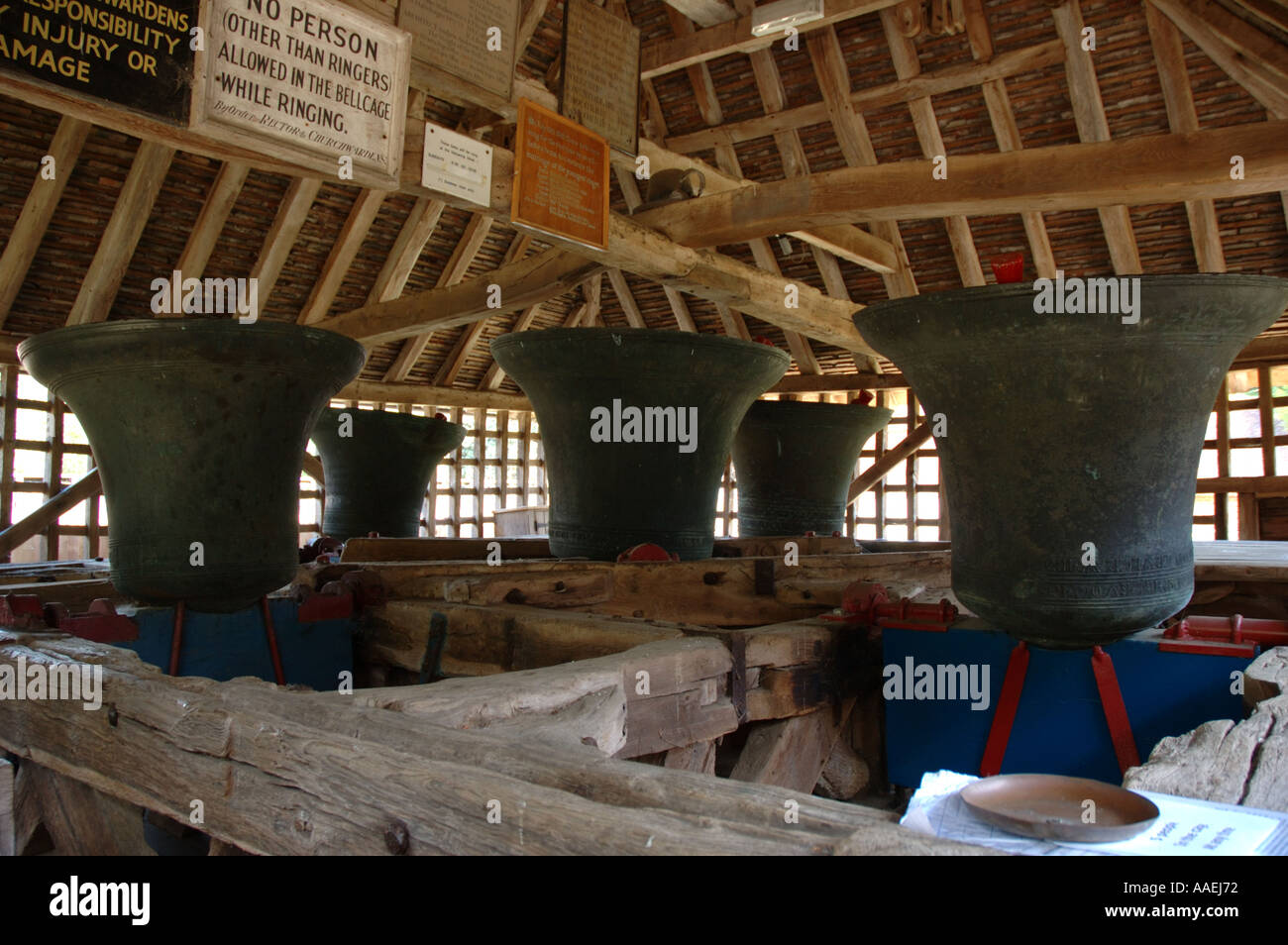 Bells in medieval bell cage, East Bergholt, Suffolk, UK Stock Photo - Alamy