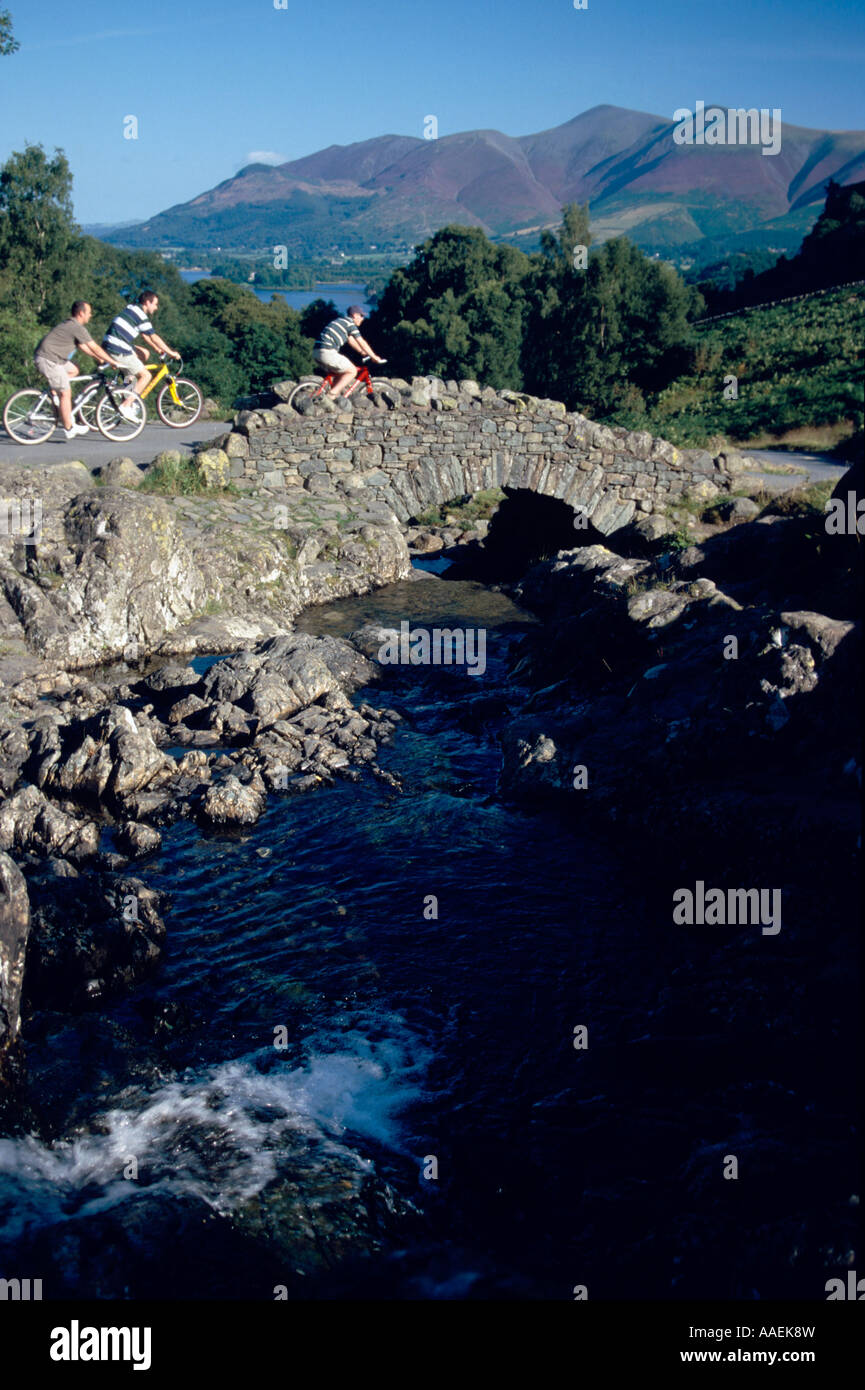 Bicycle tour stopping at Ashley Bridge near Keswick Lake District ...