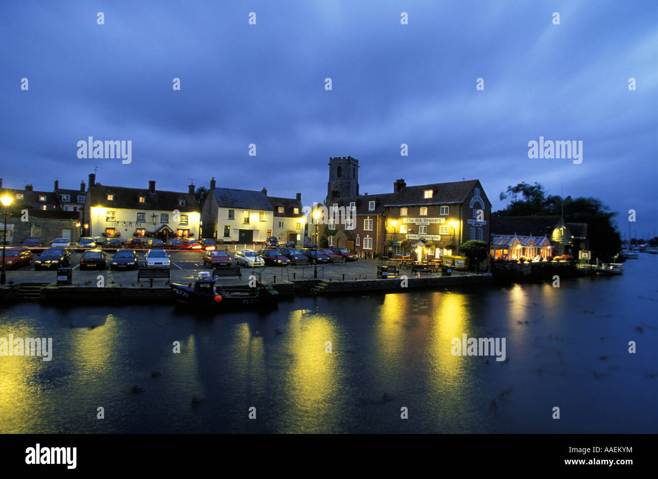 View over river to illuminated market town Wareham Dorst United Kingdom ...
