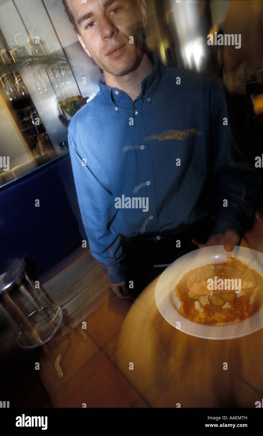 Waiter serving meal Cafe Soho London London England United Kingdom ...