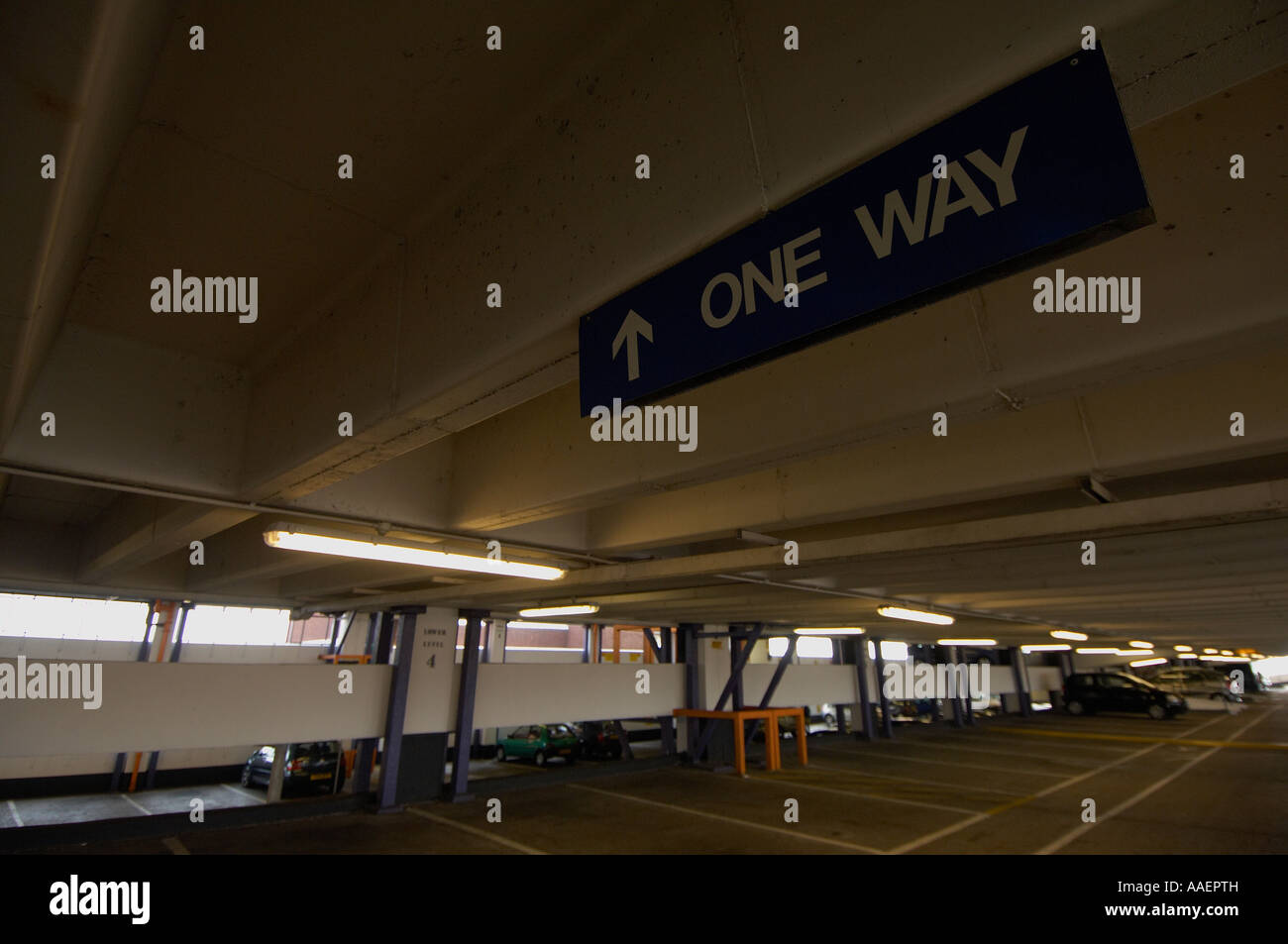 One way sign on ceiling of multi-storey car-park Stock Photo - Alamy