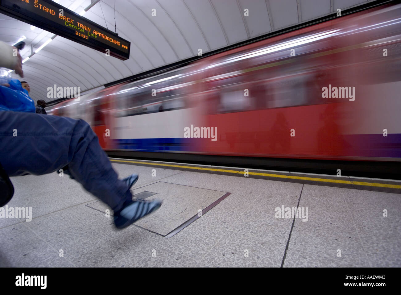 London Underground tube network with speeding train entering station ...