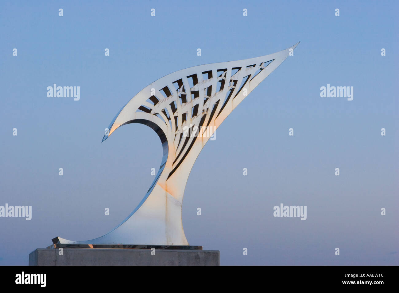 Dawn light on Iconic Design Stainless steel Wave feature on plinth ...