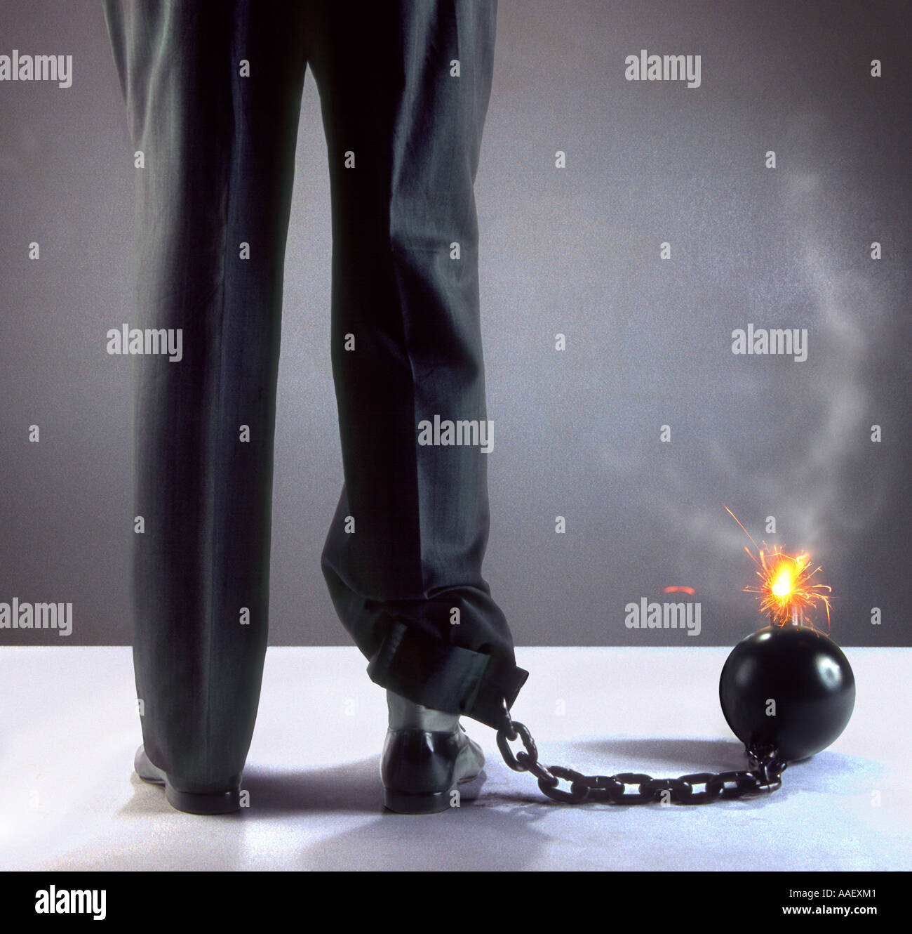 a business man in trouble. a bomb chained on his leg is ignited Stock ...
