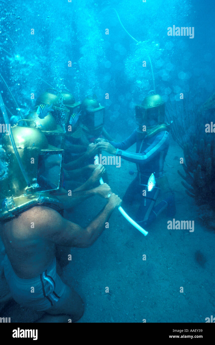 Bermuda Helmet Dive People kneeling on the ocean bottom Stock Photo - Alamy