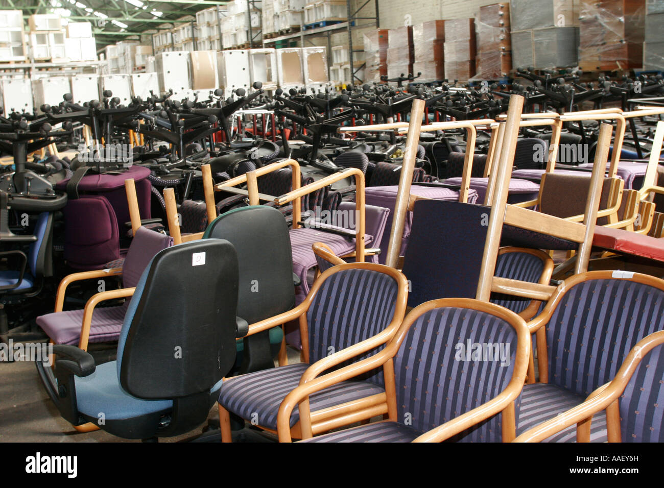 Used Office furniture in warehouse for recycling Stock Photo - Alamy