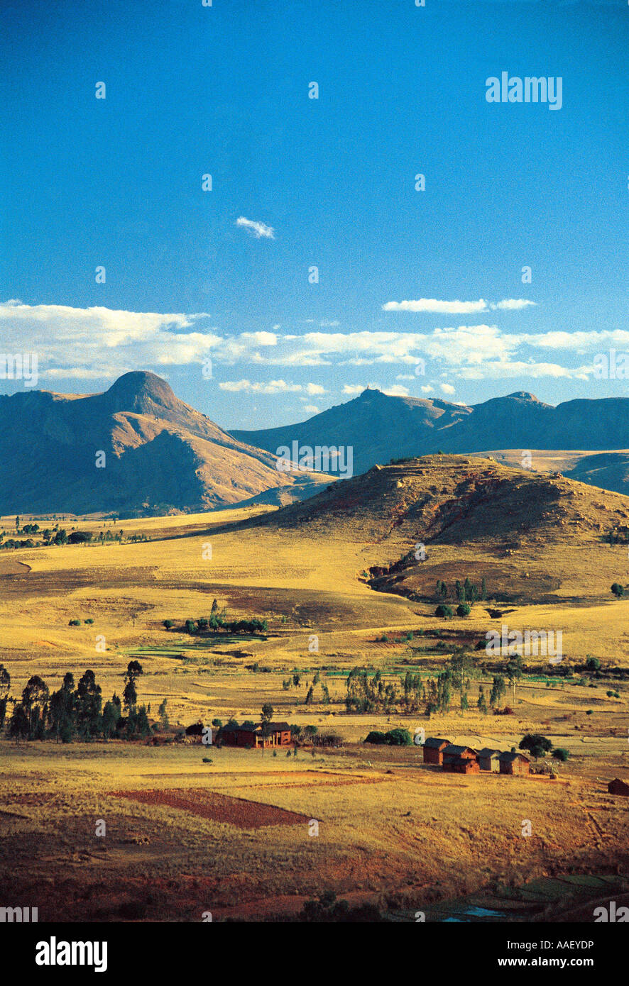Hilly scenery showing typical housing Central Madagascar Stock Photo ...