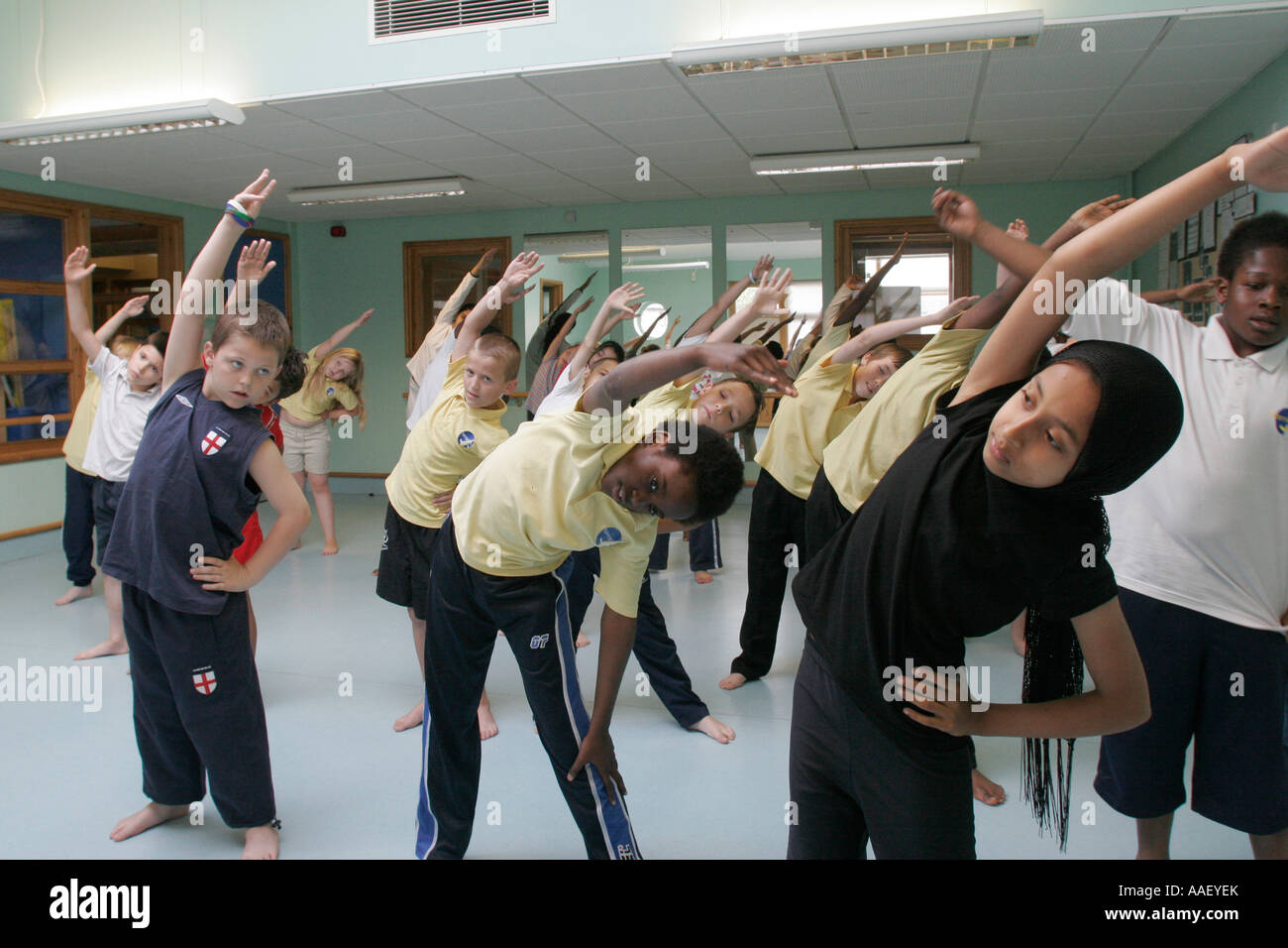 Primary school children in exercise in school gym Stock Photo - Alamy