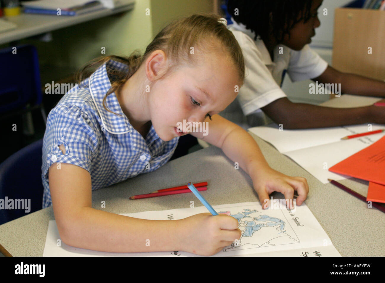 Primary school girl in school lesson Stock Photo - Alamy
