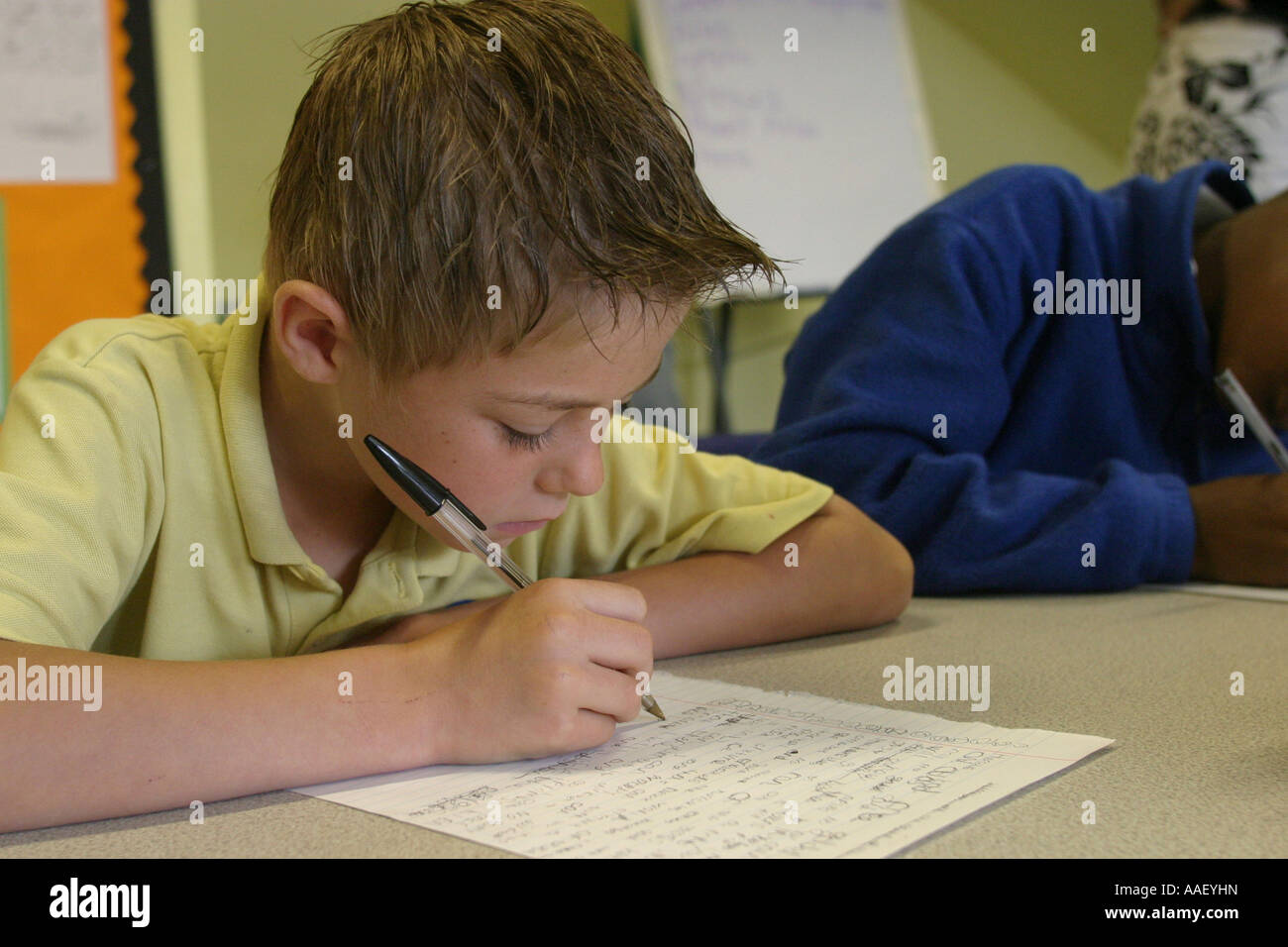 Primary school boy in class lesson Stock Photo - Alamy