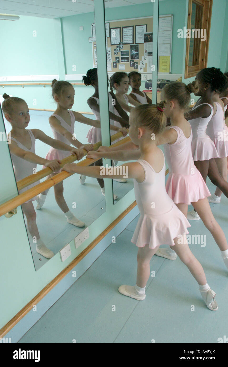 Primary school girls ballet lesson practice bar Stock Photo - Alamy