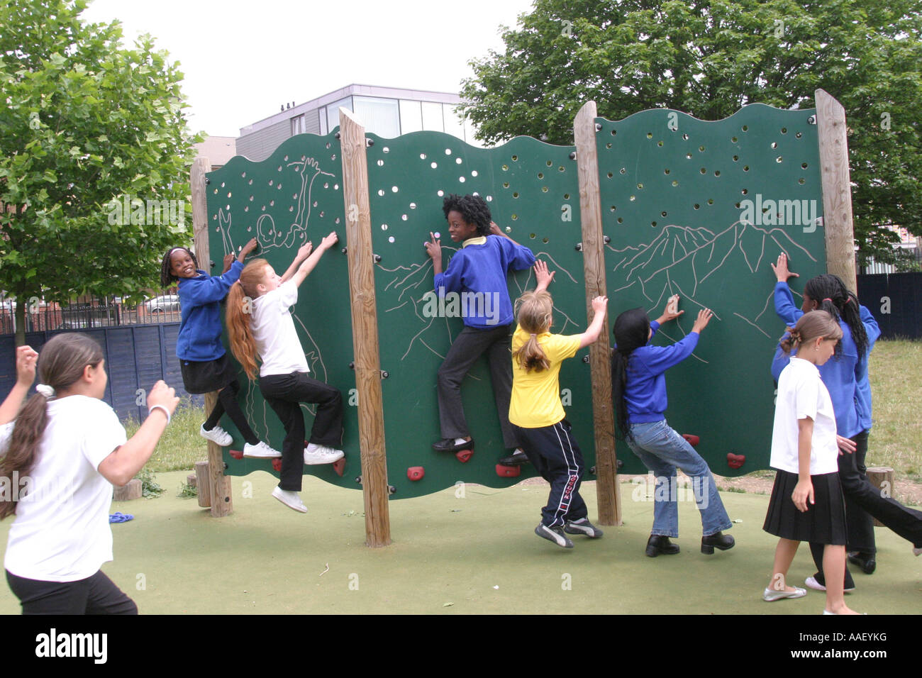 Primary school children play in playground during break from lessons ...