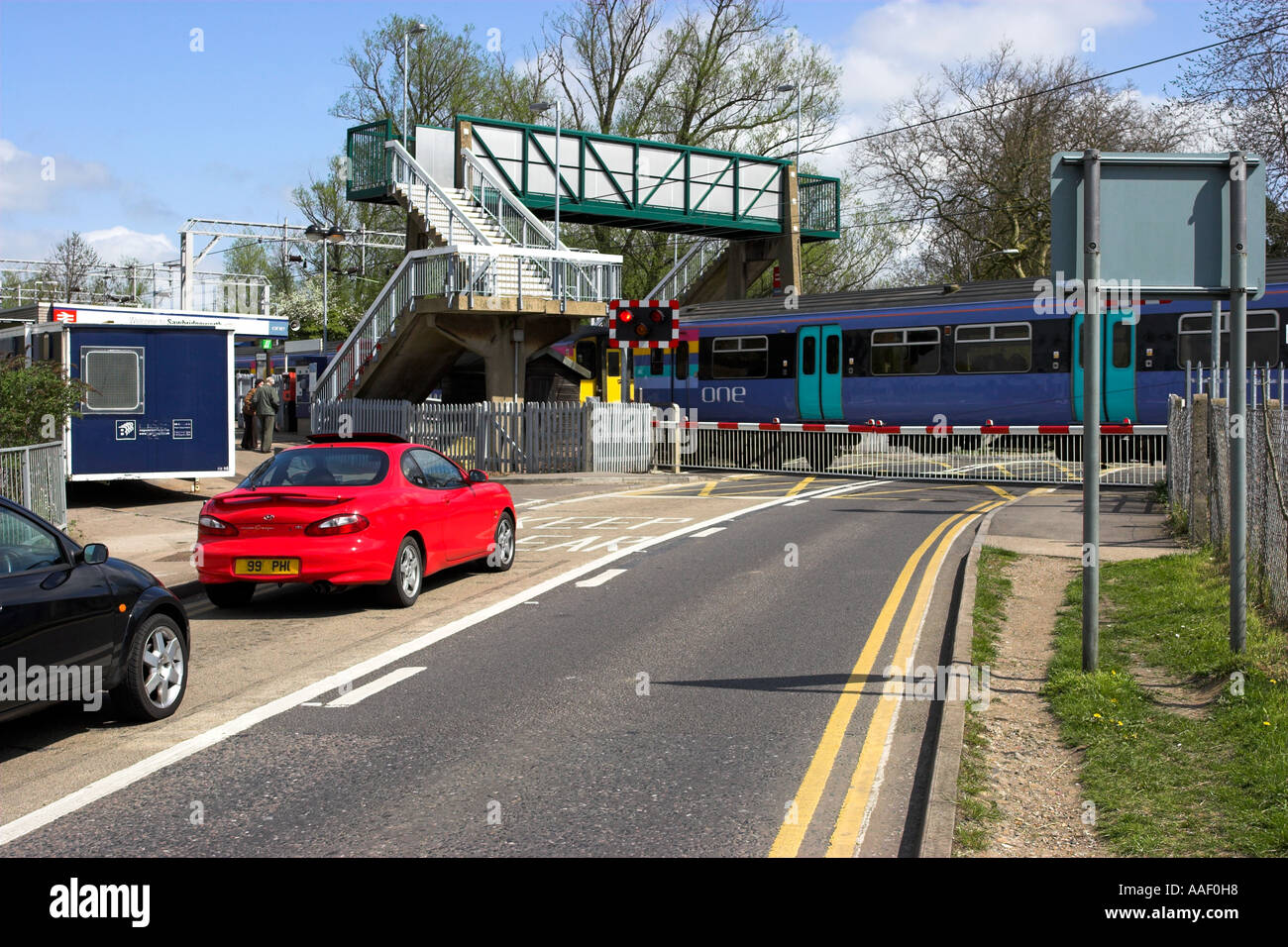 Car wait railway rail level crossing hi-res stock photography and ...