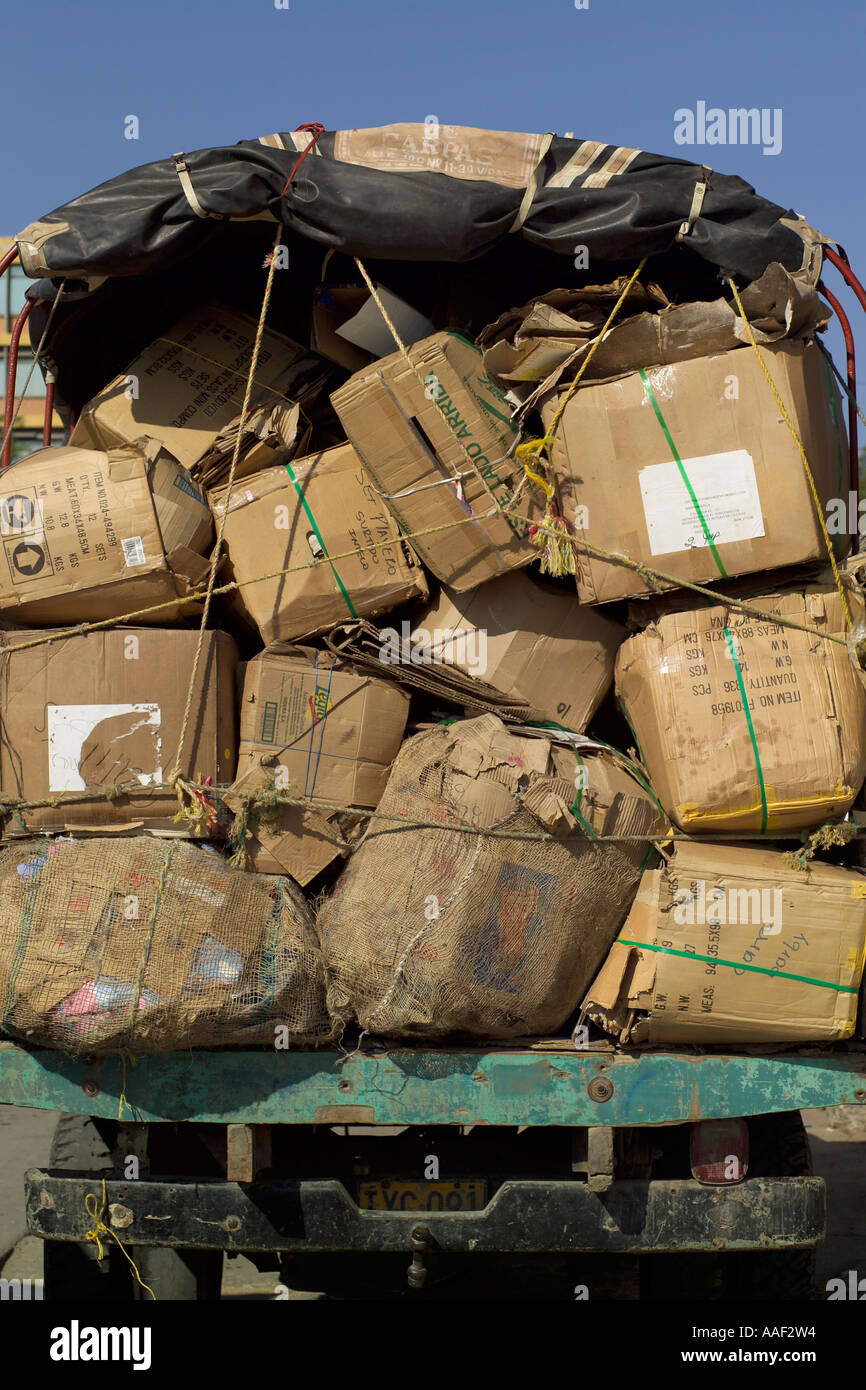 Full load of boxes on truck held together by rope Stock Photo - Alamy