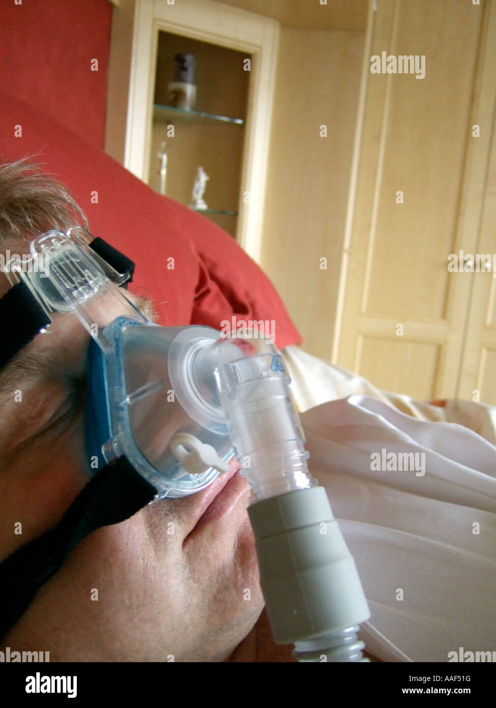 sleeping with CPAP Mask Stock Photo - Alamy