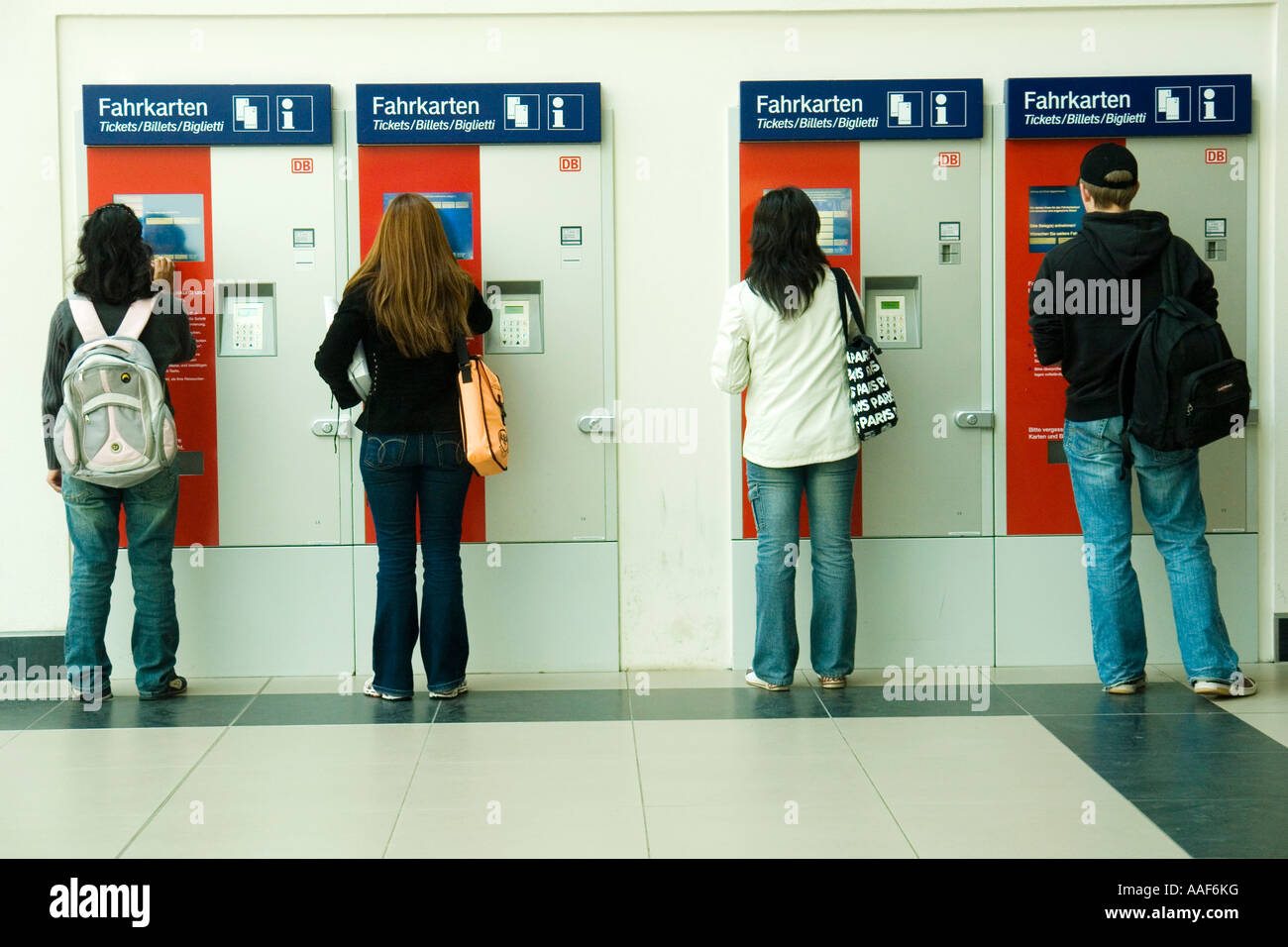 Young people buying Tickets at vending machine Dresden Main Station ...
