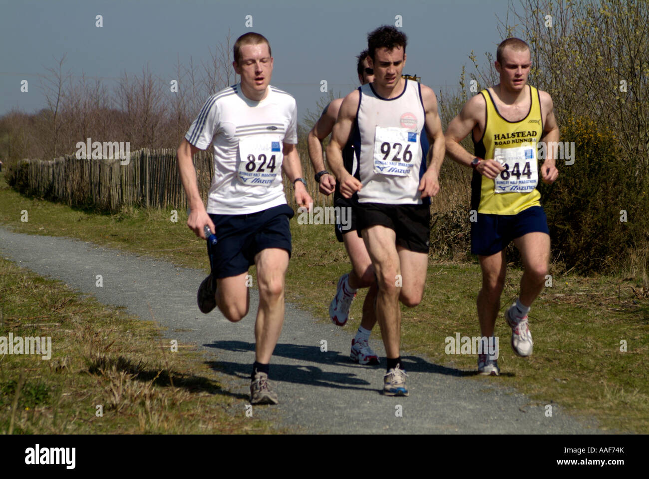 Group of men running Stock Photo - Alamy
